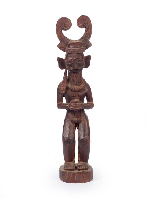 Bonhams : A Nias male ancestor figure 96cm high (38" long)