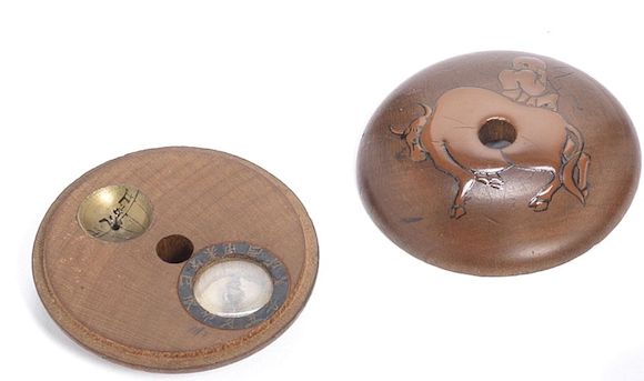 Bonhams : A mid 19th century wood and lacquered kagami buta-type netsuke