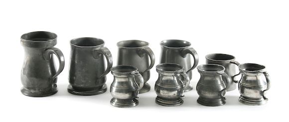 Bonhams : Three tulip-shape 19th Century pewter mugs