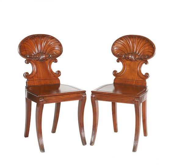 Bonhams : A pair of 19th century mahogany carved shell back hall chairs