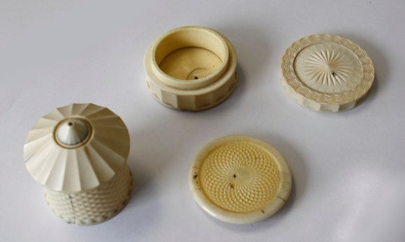 Bonhams : A Victorian carved ivory thread holder and a circular box