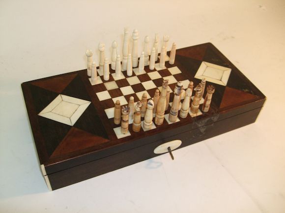 Bonhams : An ivory chess set and ivory and hardwood inlaid games board ...