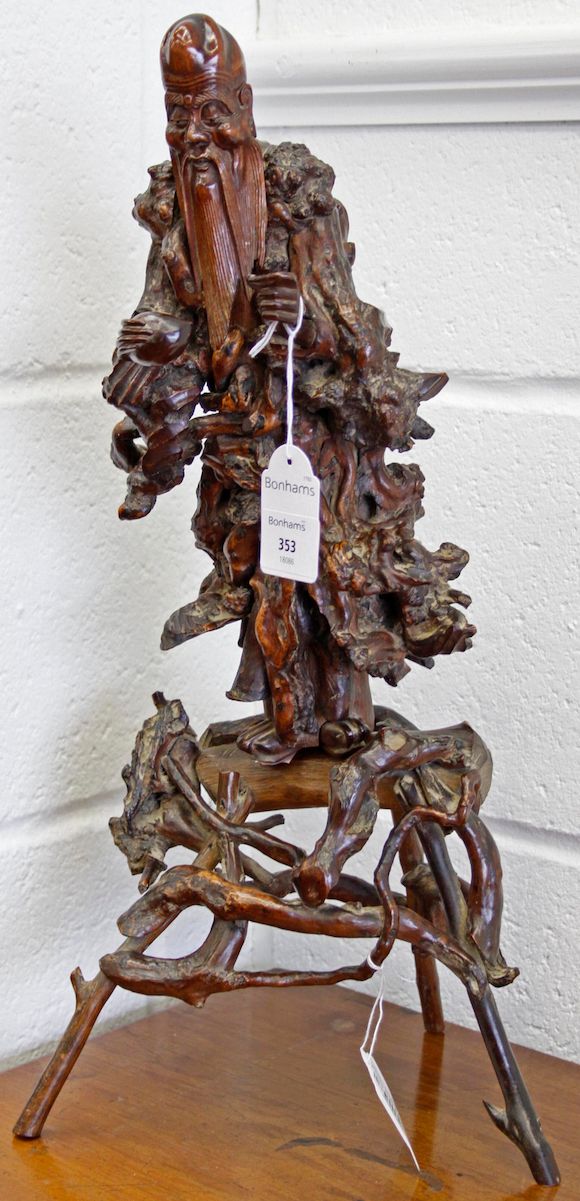 Bonhams : A Chinese Mingay style root carving of a Deity,