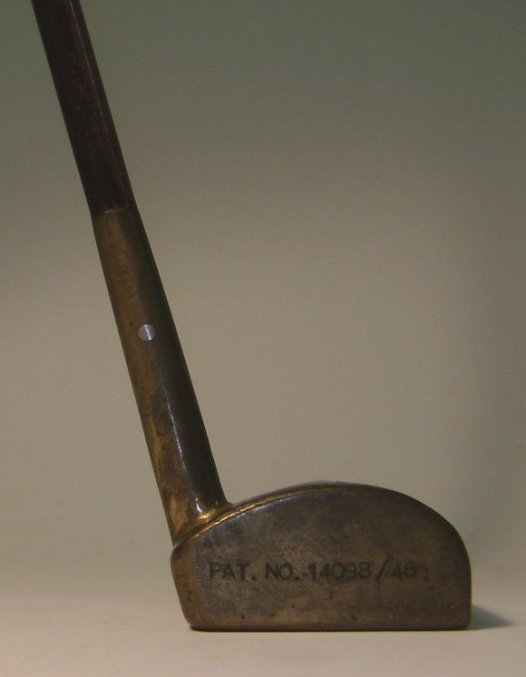 Bonhams : A steel shafted small headed brass putter