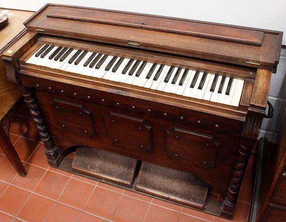 Bonhams : A late 19th Century oak cased poratable organ,