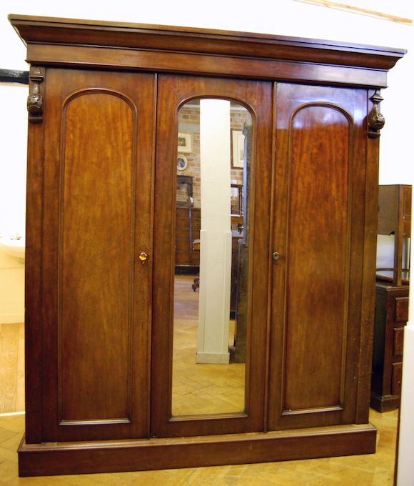 Bonhams : A mid-Victorian mahogany triple wardrobe Bearing ivorine ...
