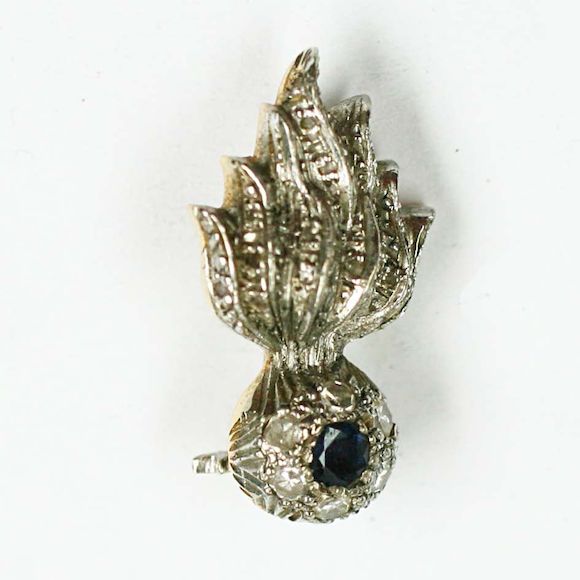 Bonhams : Of Military interest A sapphire and diamond fused grenade brooch,