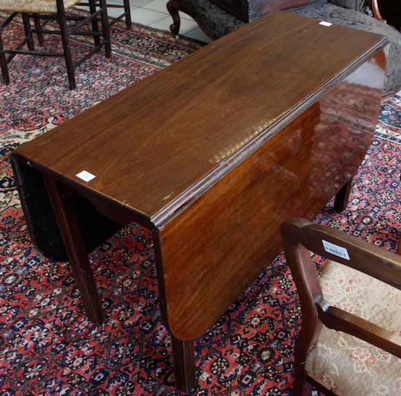 Bonhams : A mahogany drop-leaf dining table,