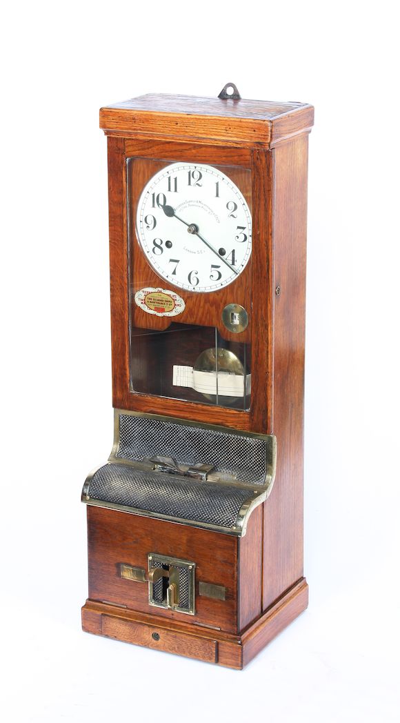 Bonhams : A 1920s oak and brass mounted wall time recorder