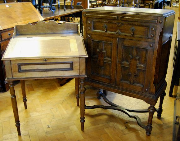 Bonhams : A 1930s oak 'Jacobethan'-style cocktail cabinet