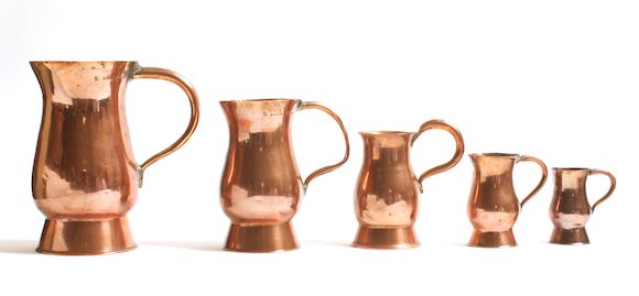 Bonhams : A group of five graduated copper measures
