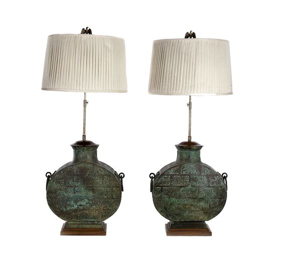 Bonhams : A pair of Han style twin-light bronze lamps