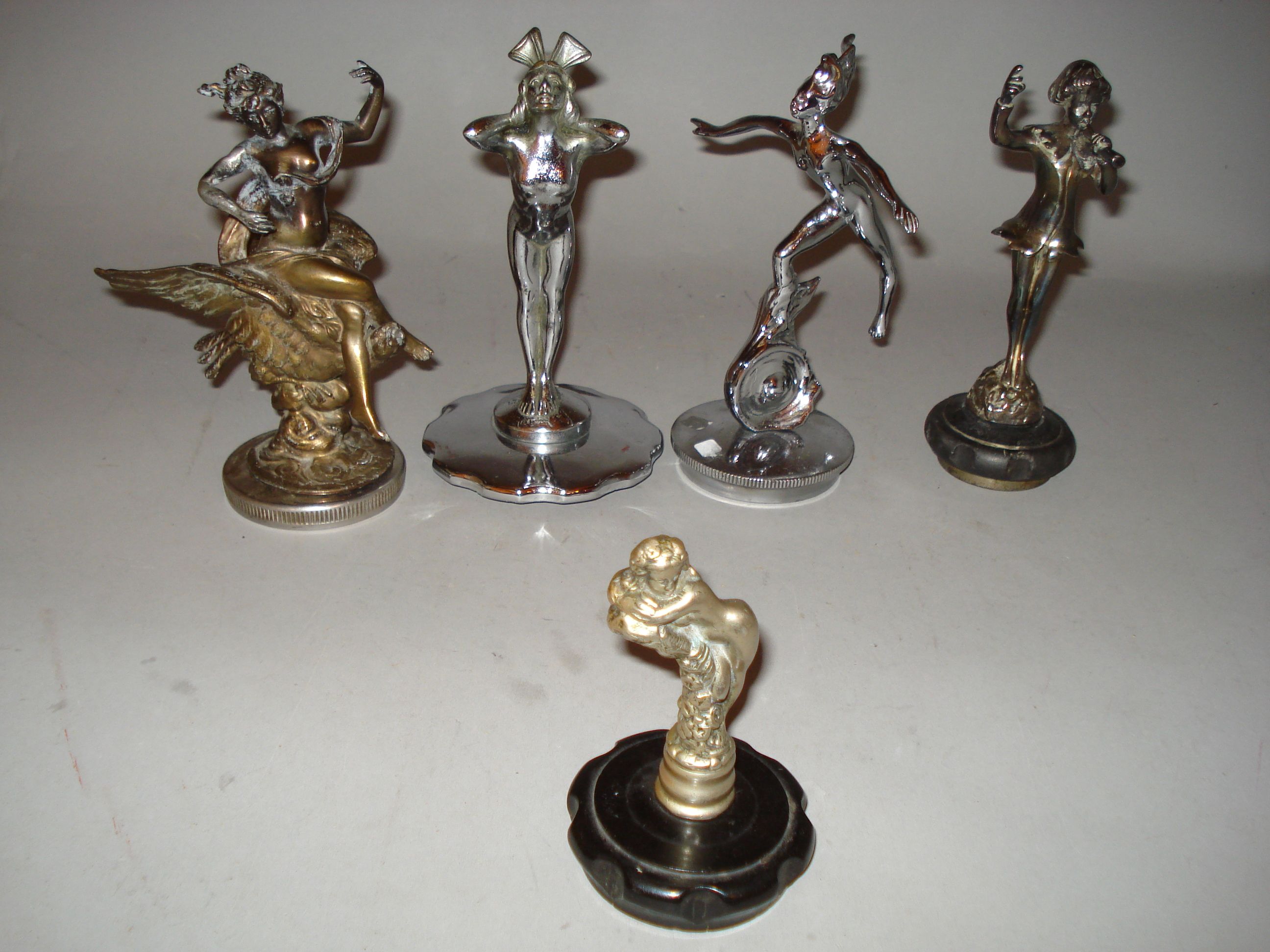 Bonhams Cars : Three female mascots,
