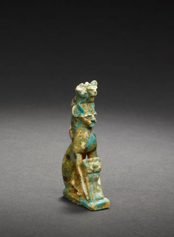 Bonhams : An Egyptian blue glazed composition cat of Bastet amulet