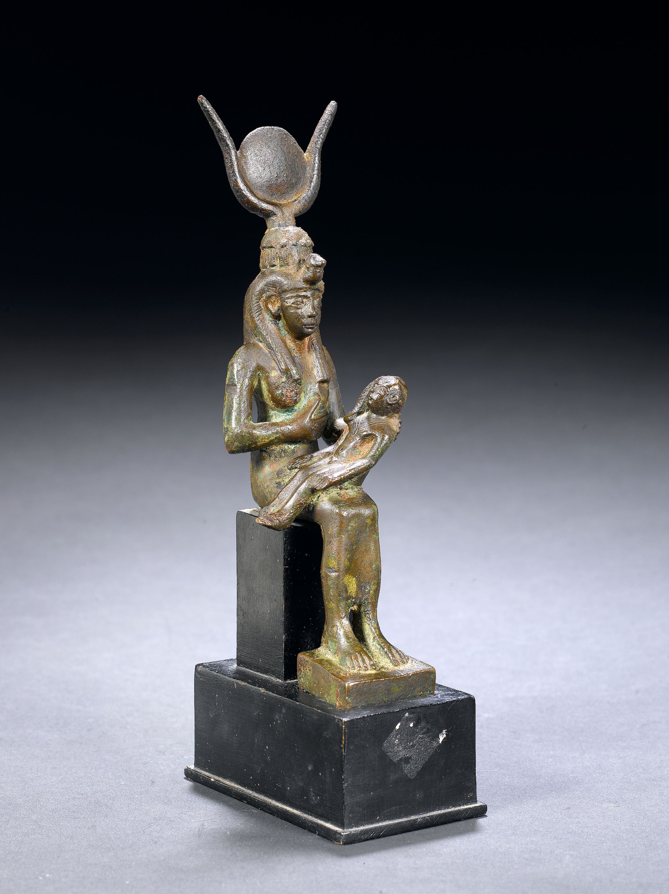 Bonhams : An Egyptian bronze figure of Isis and Horus