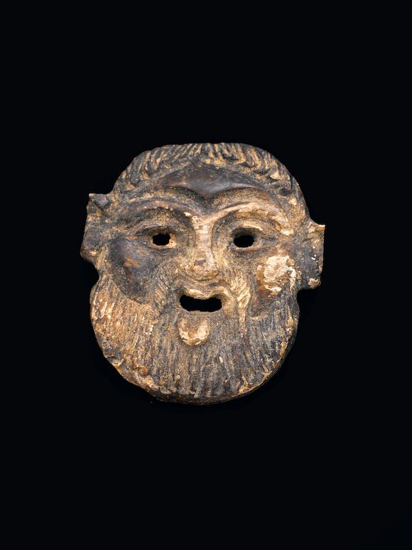 Bonhams : A Greek bone theatre mask plaque