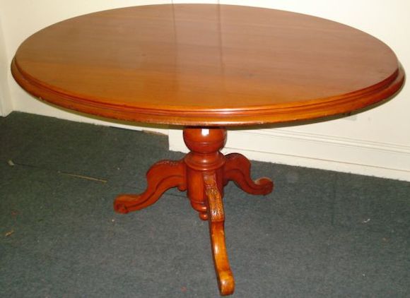 Bonhams : A Victorian loo table, the moulded edge oval tilt top on a ...