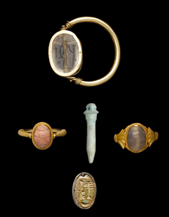 Bonhams : An Egyptian rock crystal scarab an Egyptian green glazed ...