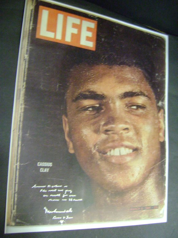 Bonhams : A reproduction magazine cover hand signed by Muhammad Ali