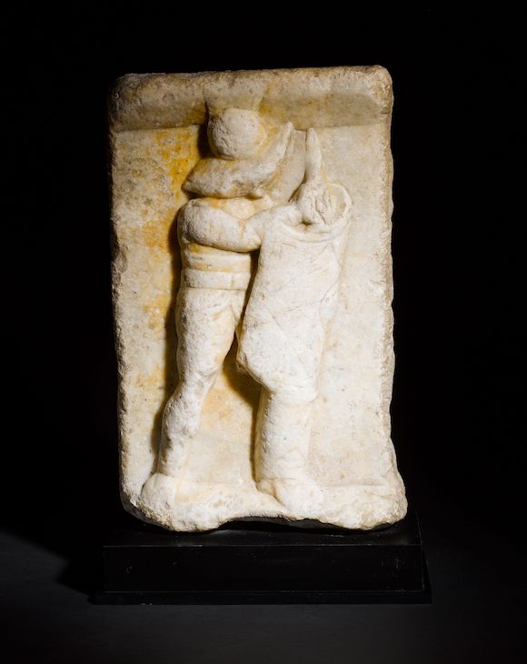 Bonhams : A Roman marble relief of a Murmillo gladiator