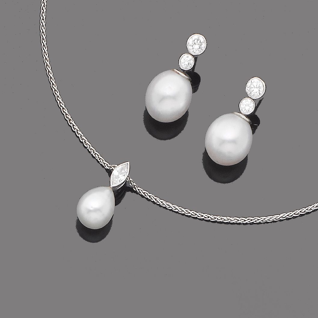 Bonhams : A cultured pearl and diamond pendant and earring suite, the ...