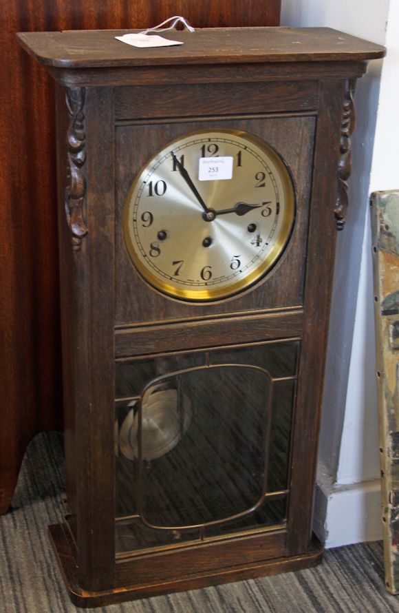 Bonhams : A George V oak cased wall clock,with circular silvered dial ...