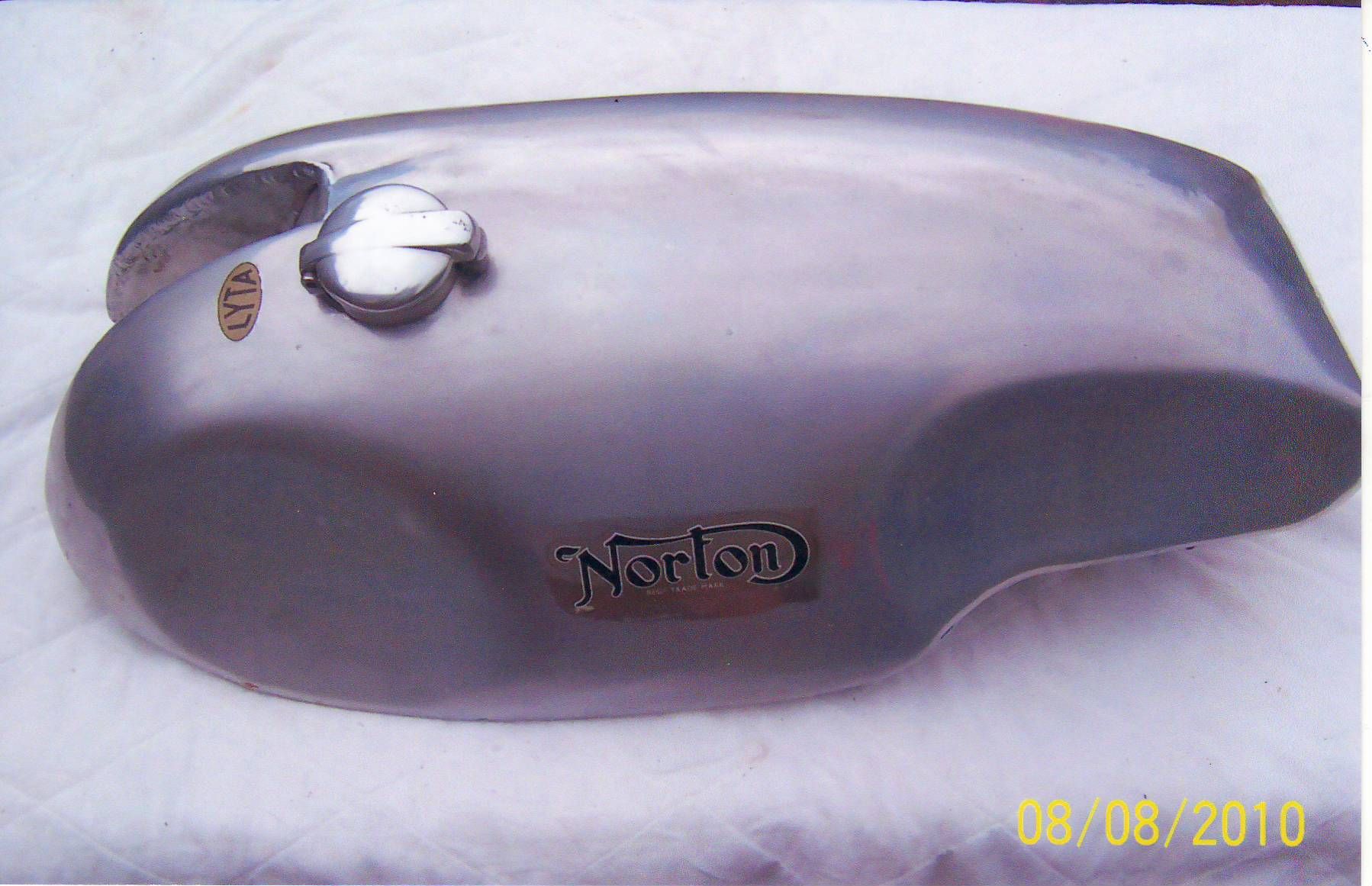 Bonhams Cars : A Norton Lyta short-circuit alloy petrol tank.