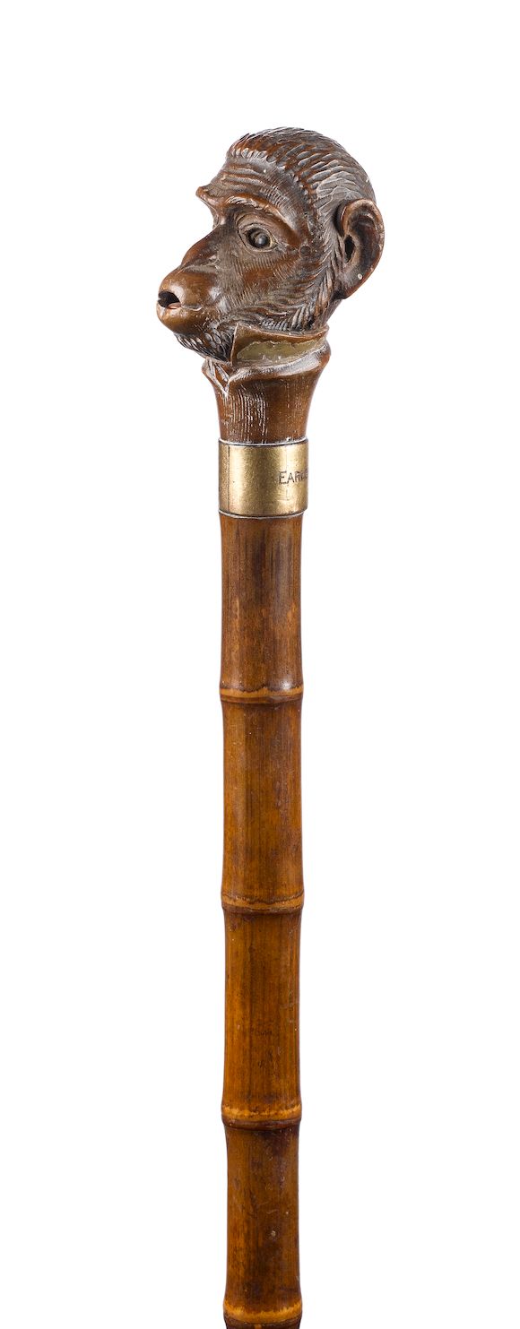 Bonhams : A Victorian carved wooden articulated monkey head gadget cane,