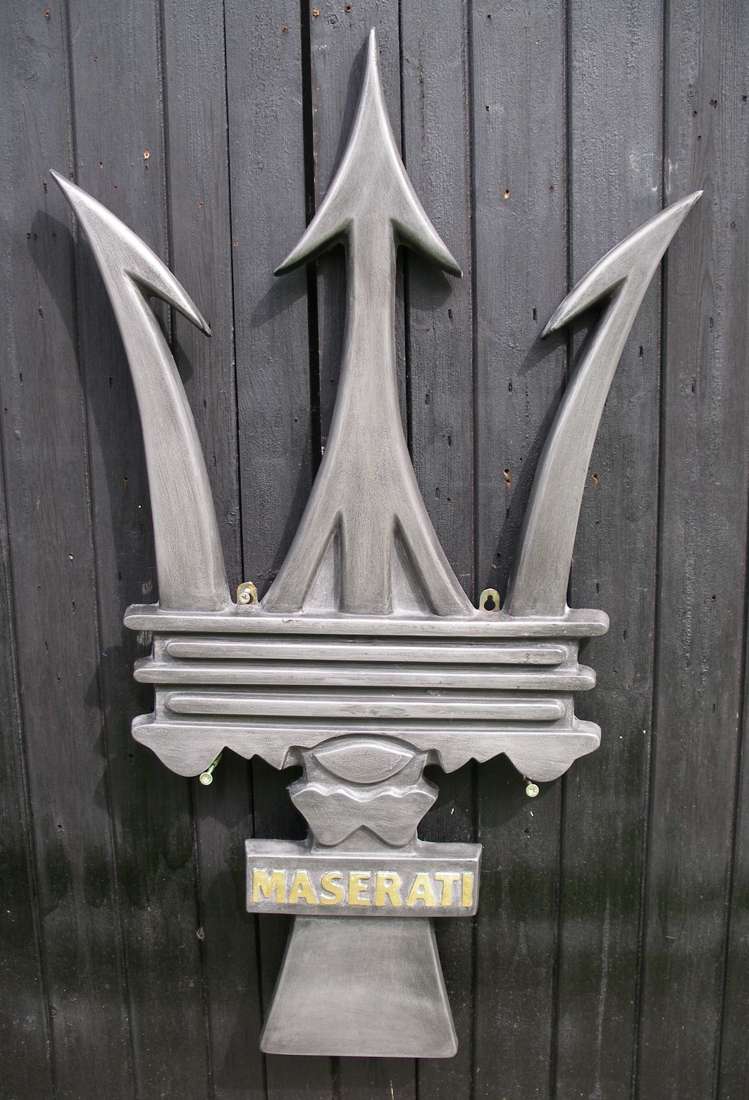 Bonhams Cars : A cold-cast aluminium Maserati Trident emblem,