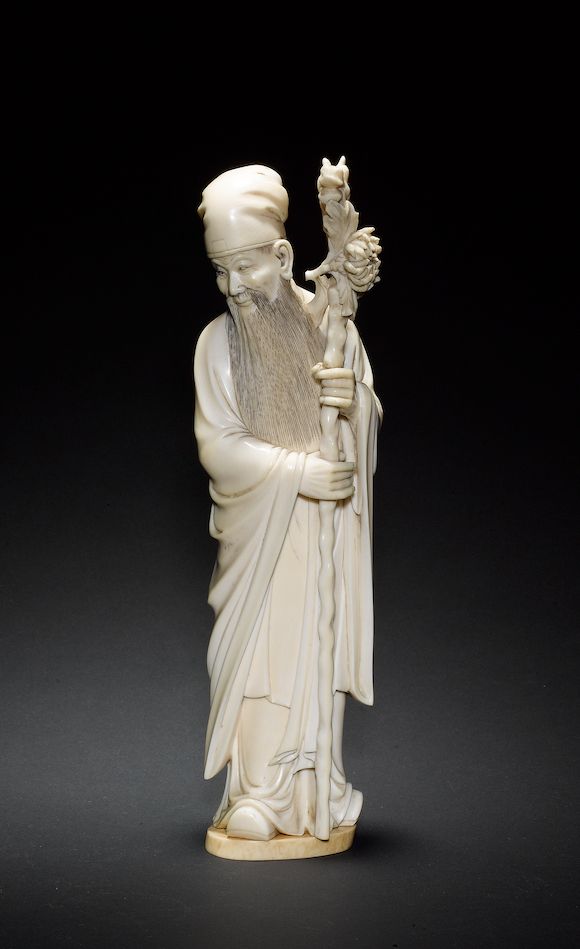Bonhams : A stained ivory figure of a standing scholar or deity ...
