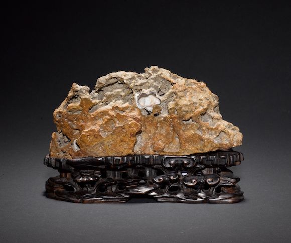 Bonhams : A Chinese scholar's rock (Gongshi) on a fitted wood stand