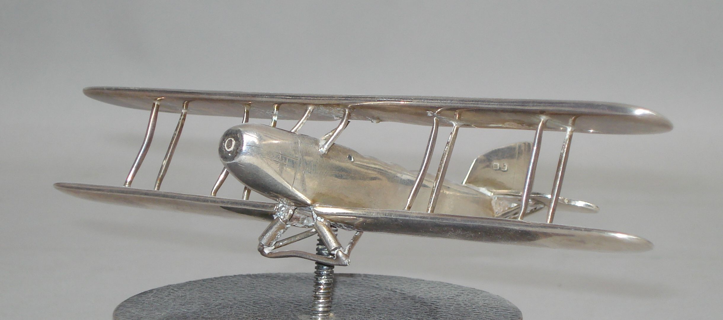 Bonhams Cars : A Silver model of a Bi-plane, Birmingham, 1931,