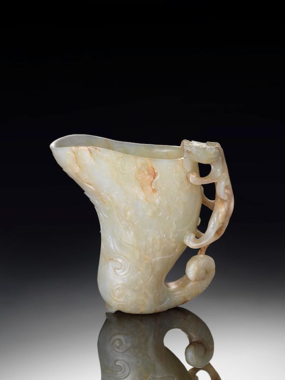 Bonhams : A pale green jade rhyton cup 17th/18th century