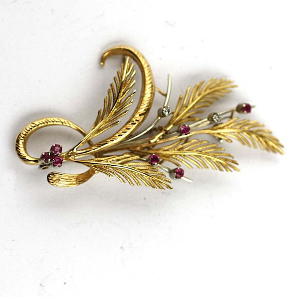 Bonhams : An 18ct gold mounted ruby and diamond set spray brooch,