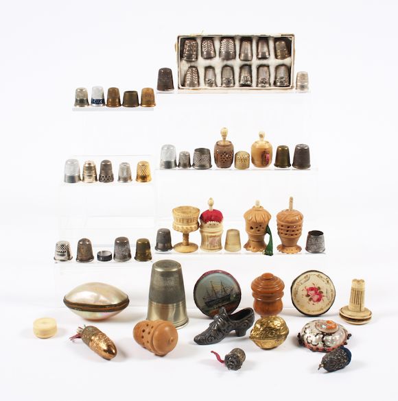 Bonhams : A group of thimble cases, thimbles, tape measures and pin ...