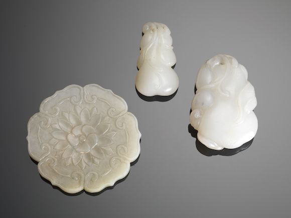 Bonhams : Three small white and pale green jade pendants 18th/19th century