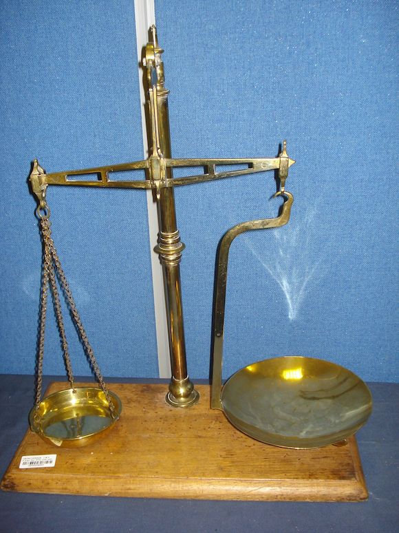 Bonhams : A brass shop scale balance on mahogany platform by Parnall ...