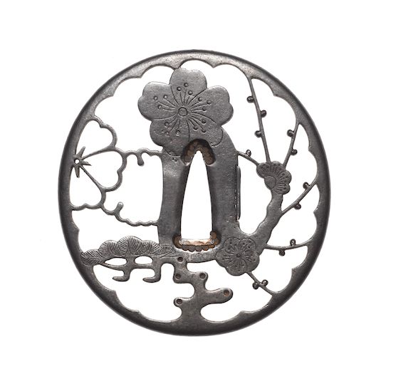 Bonhams : A large Akasaka tsuba Attributed to Tadashige, 18th century