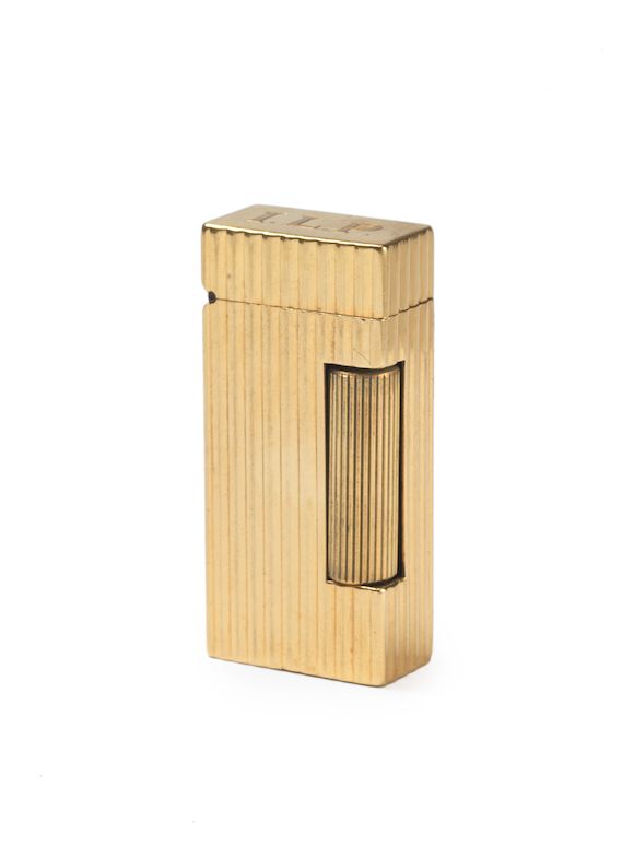 Bonhams : DUNHILL: A yellow metal mounted 'Rollalite' lighter, "Outer ...