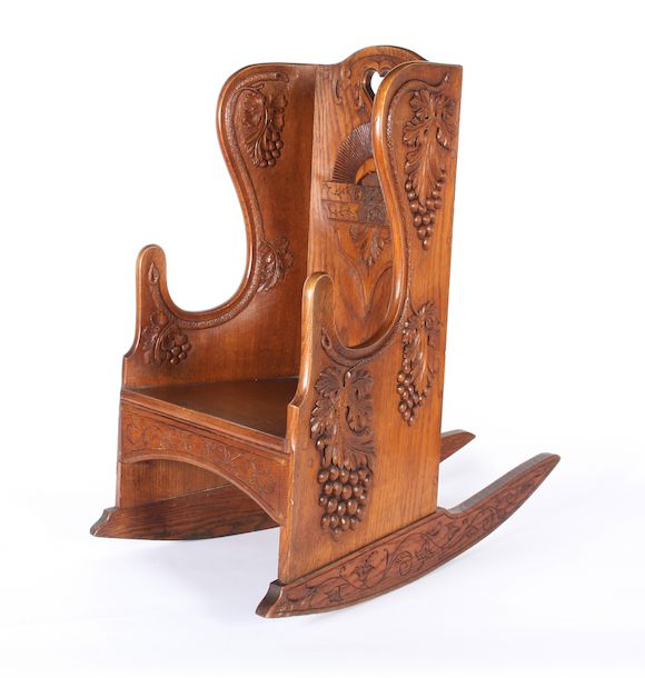 Bonhams : A carved oak child's rocking chair, in the style of Arthur W ...