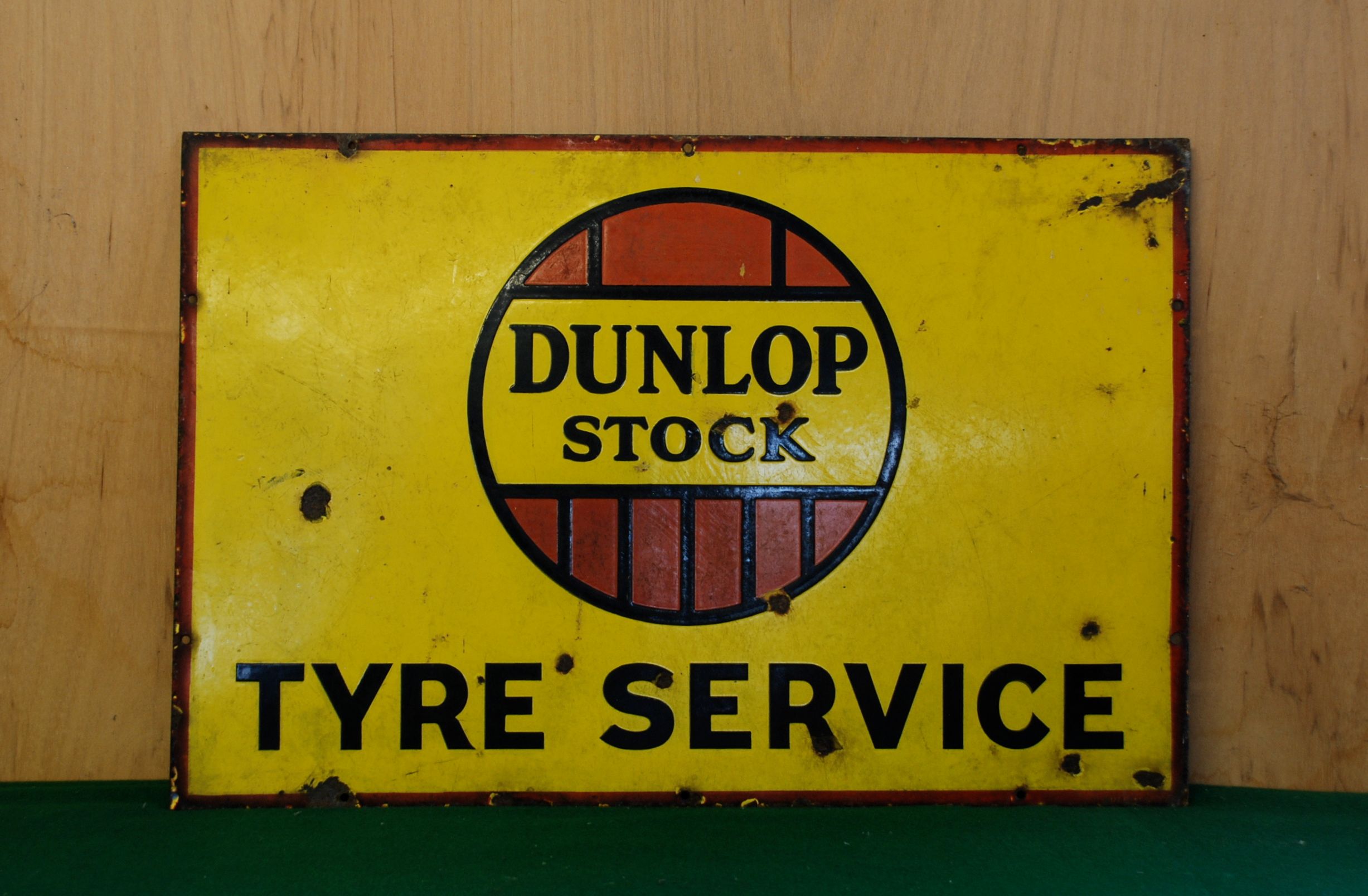 Bonhams Cars : A Dunlop Stock Tyre Service enamel sign,