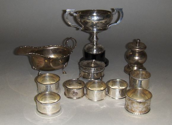 Bonhams : A silver trophy cup, a sauce boat, a pepper mill, a pin box ...