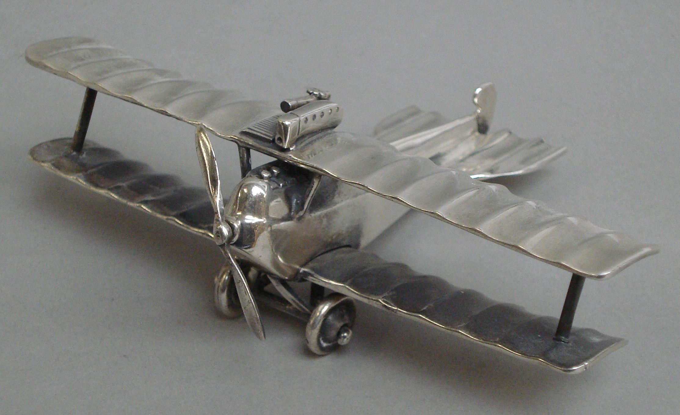 Bonhams Cars : A fine Silver model of a Bi-Plane, by Hansa,