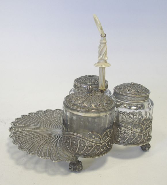 Bonhams : A Continental silver filigree three bottled frame, unmarked,