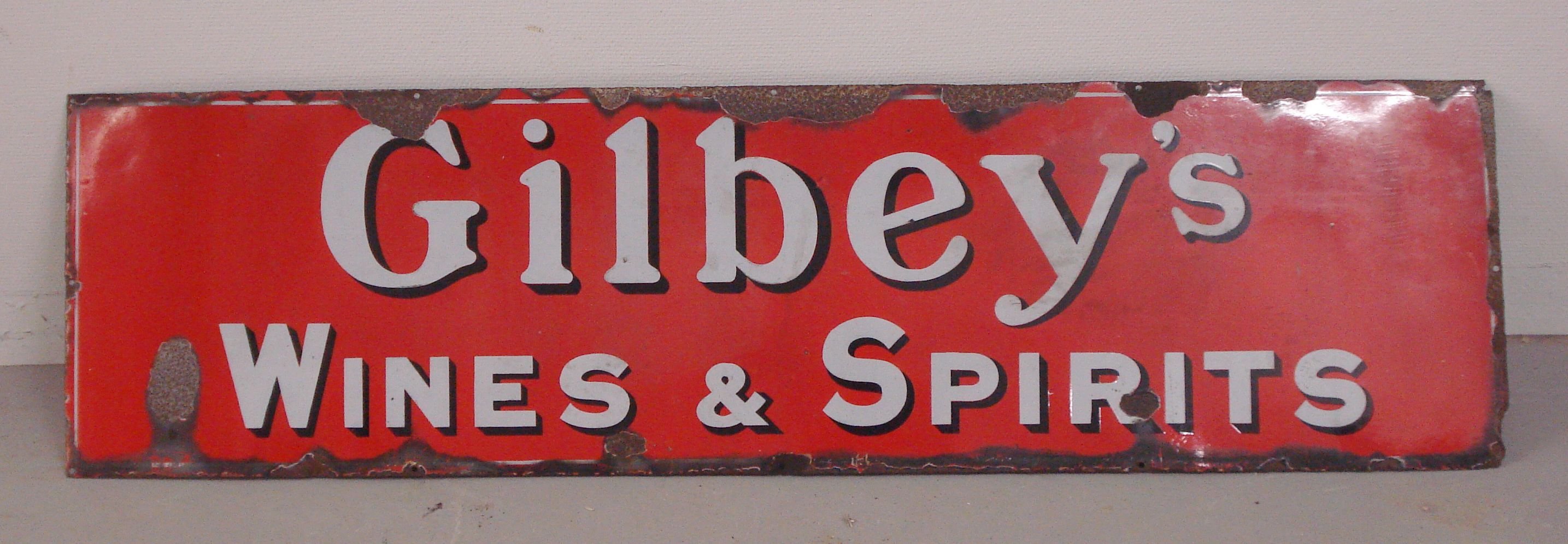 Bonhams Cars : A 'Gilbey's Wines & Spirits' enamel sign,