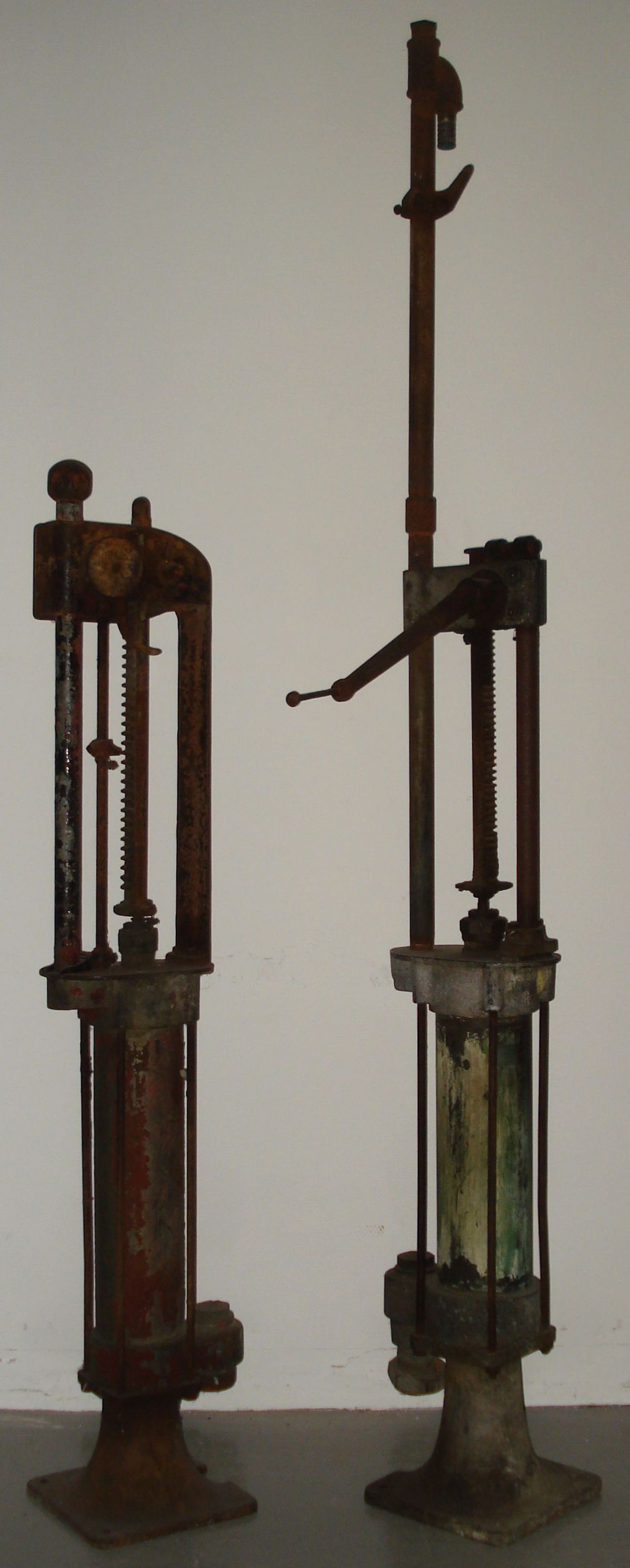 Bonhams Cars : Two hand-cranked upright skeleton petrol pumps,
