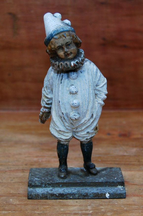 Bonhams : A cast cold-painted nodding figure of a clown