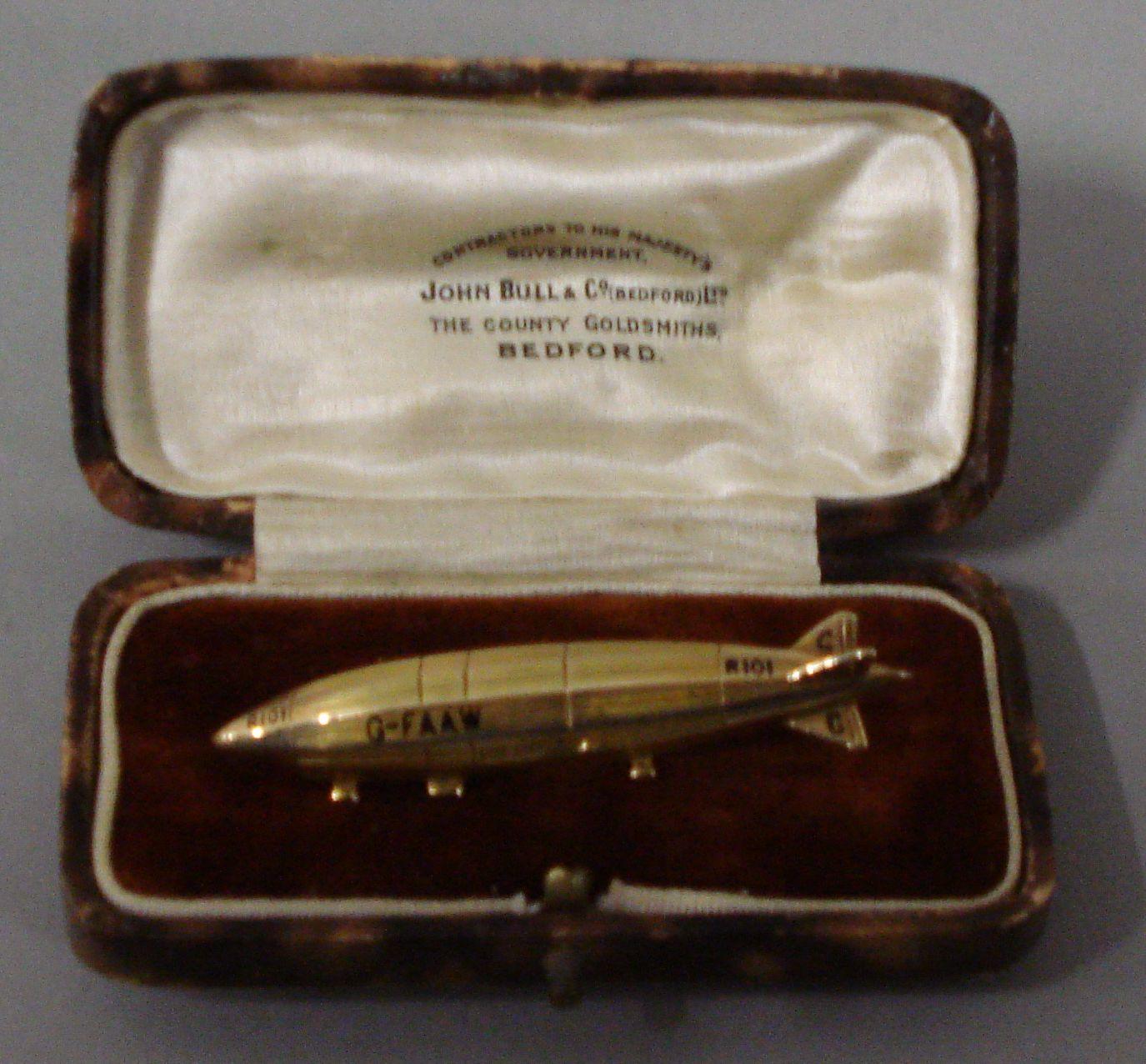 Bonhams Cars : A 9ct gold brooch in the form of the R101 airship,
