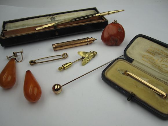 Bonhams : A gold coloured stick pin,