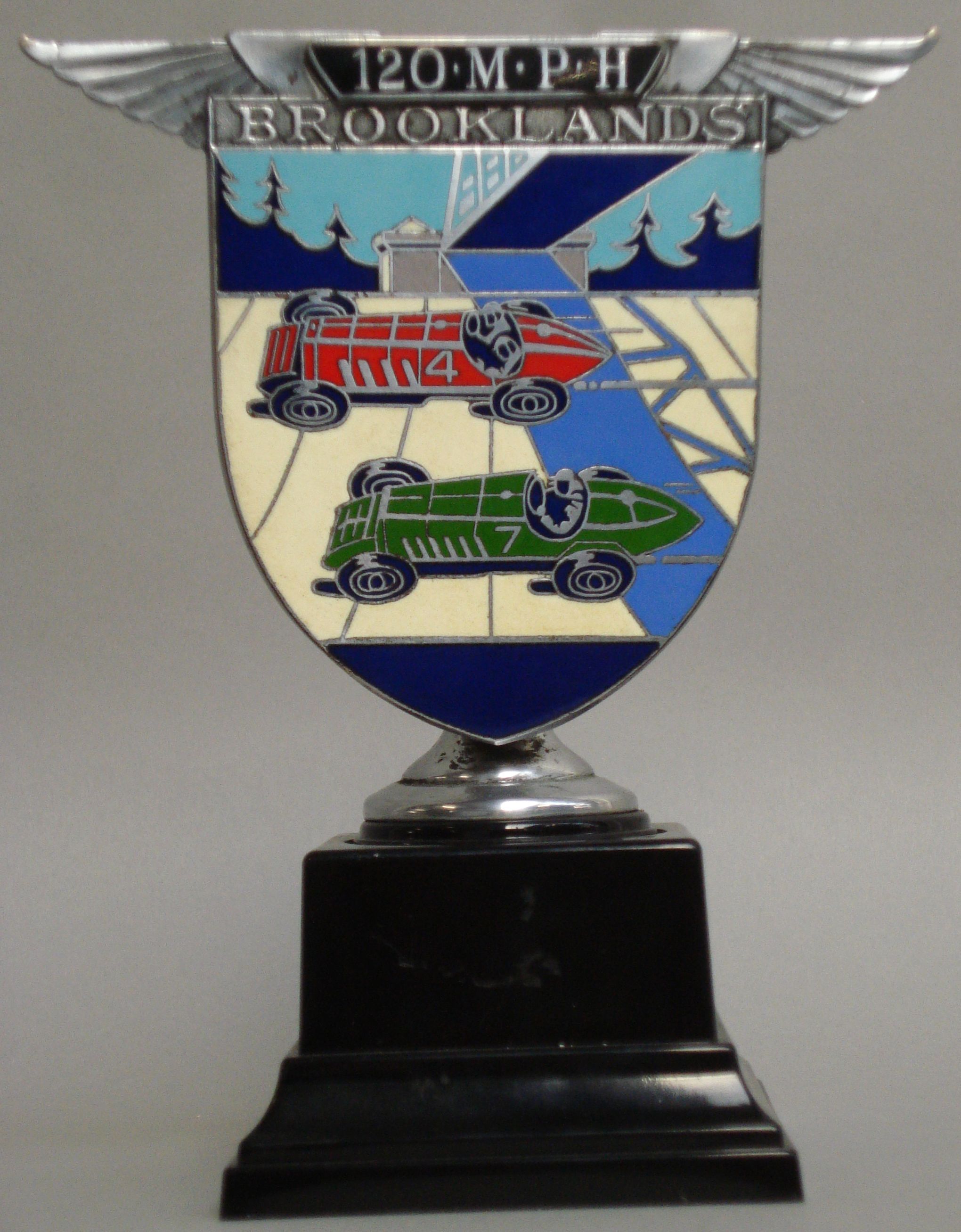 Bonhams Cars : The BARC Brooklands 120mph badge awarded to L. P. Driscoll,